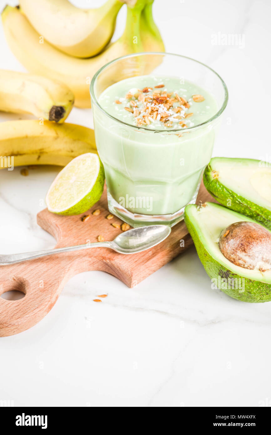 Healthy summer drink, avocado and banana smoothie with lime, granola ...