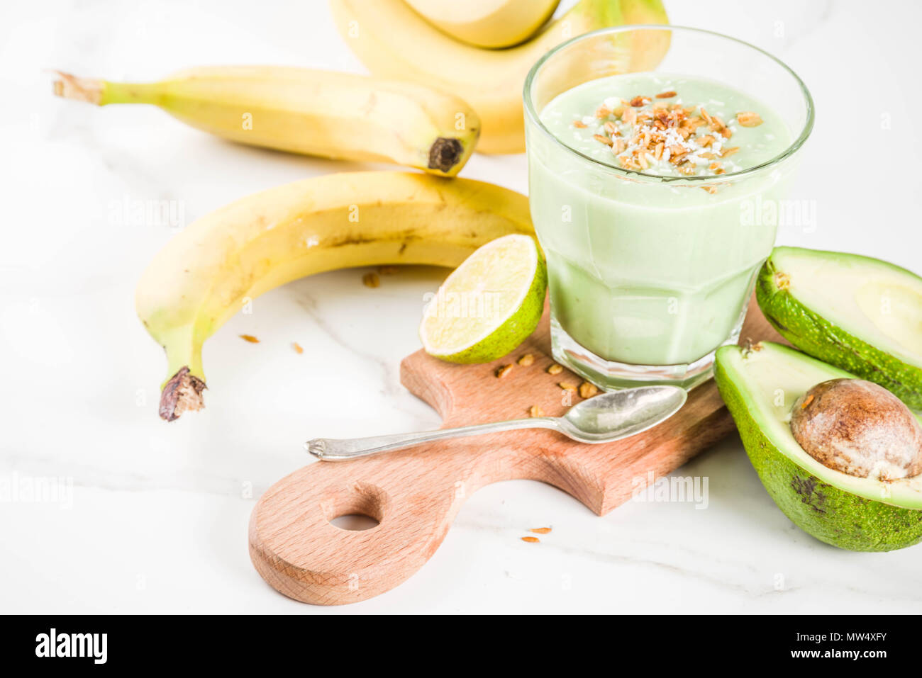 Healthy summer drink, avocado and banana smoothie with lime, granola ...