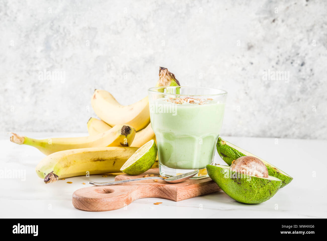 Healthy summer drink, avocado and banana smoothie with lime, granola ...