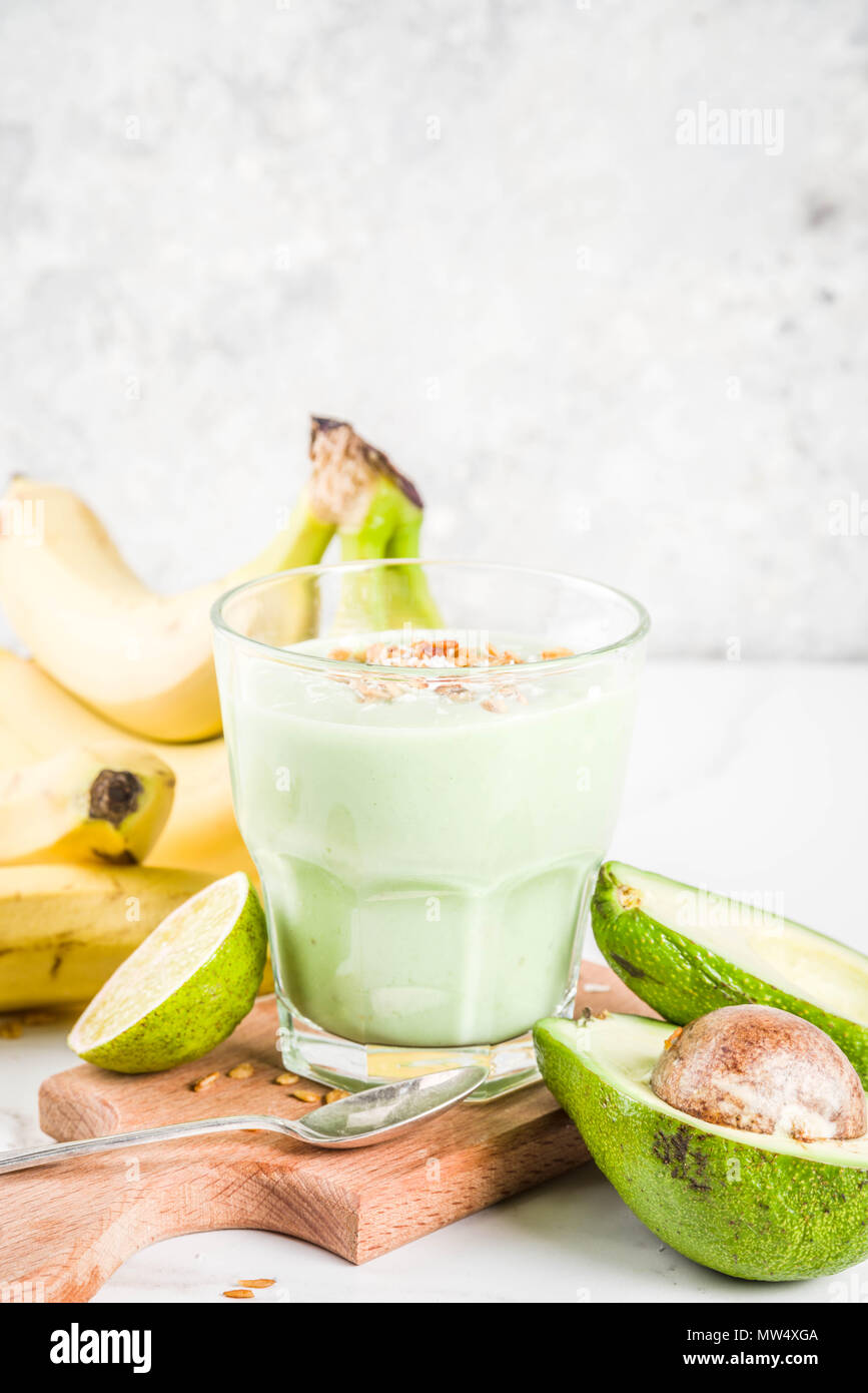 Healthy summer drink, avocado and banana smoothie with lime, granola ...