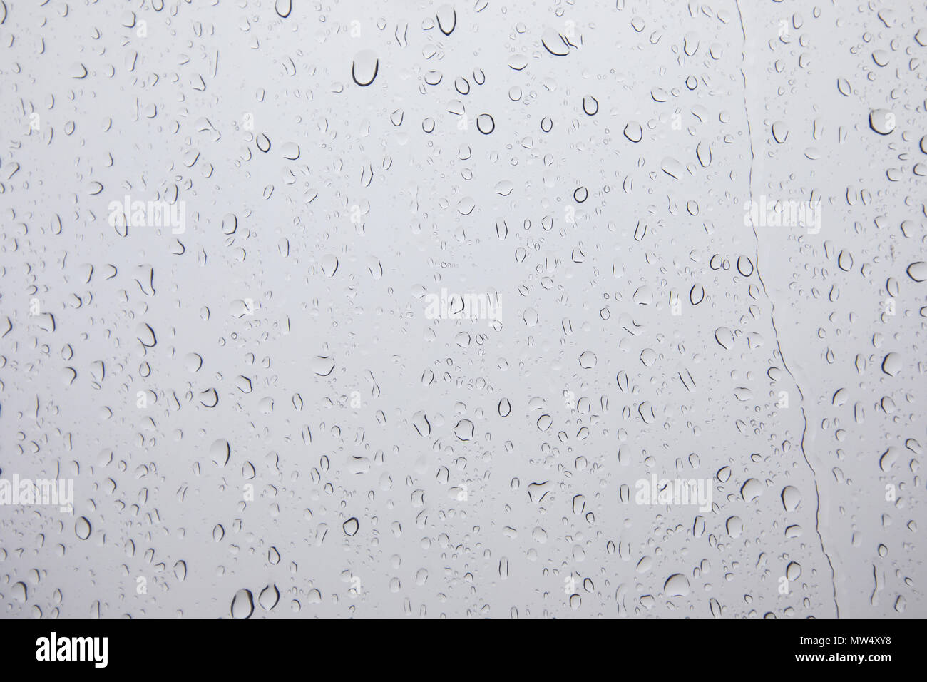 Wet glass background. Rain on the glass. Water drops Stock Photo - Alamy