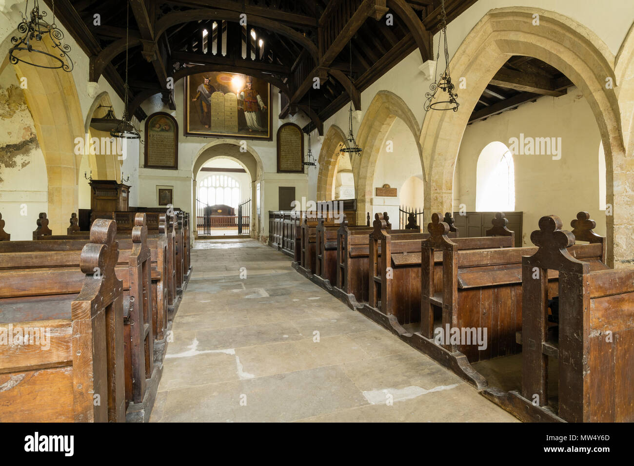 Interior of historic quaint St Martin's Church with wooden pews, aisle ...