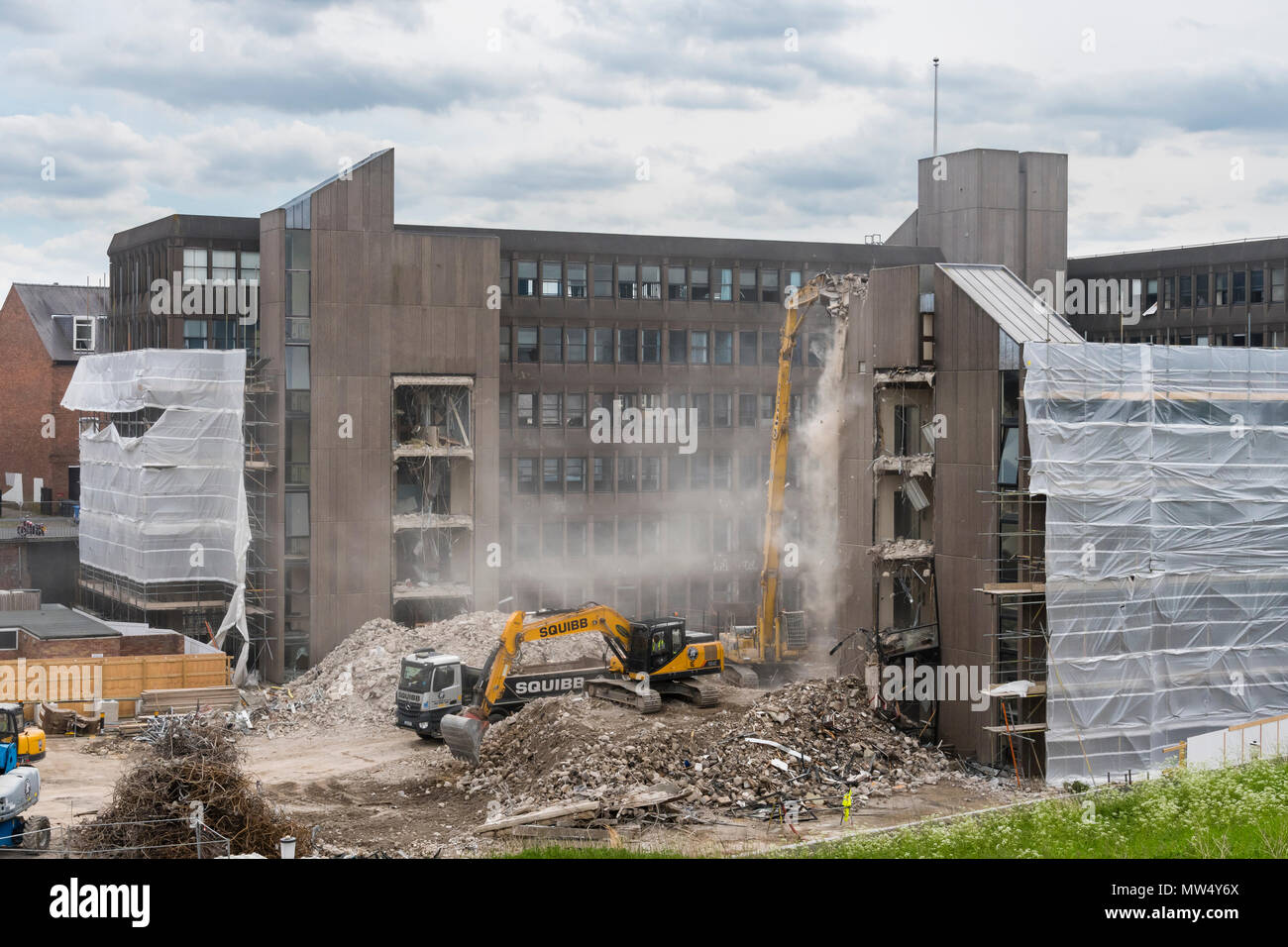 High view of demolition site with rubble, heavy machinery (excavators ...