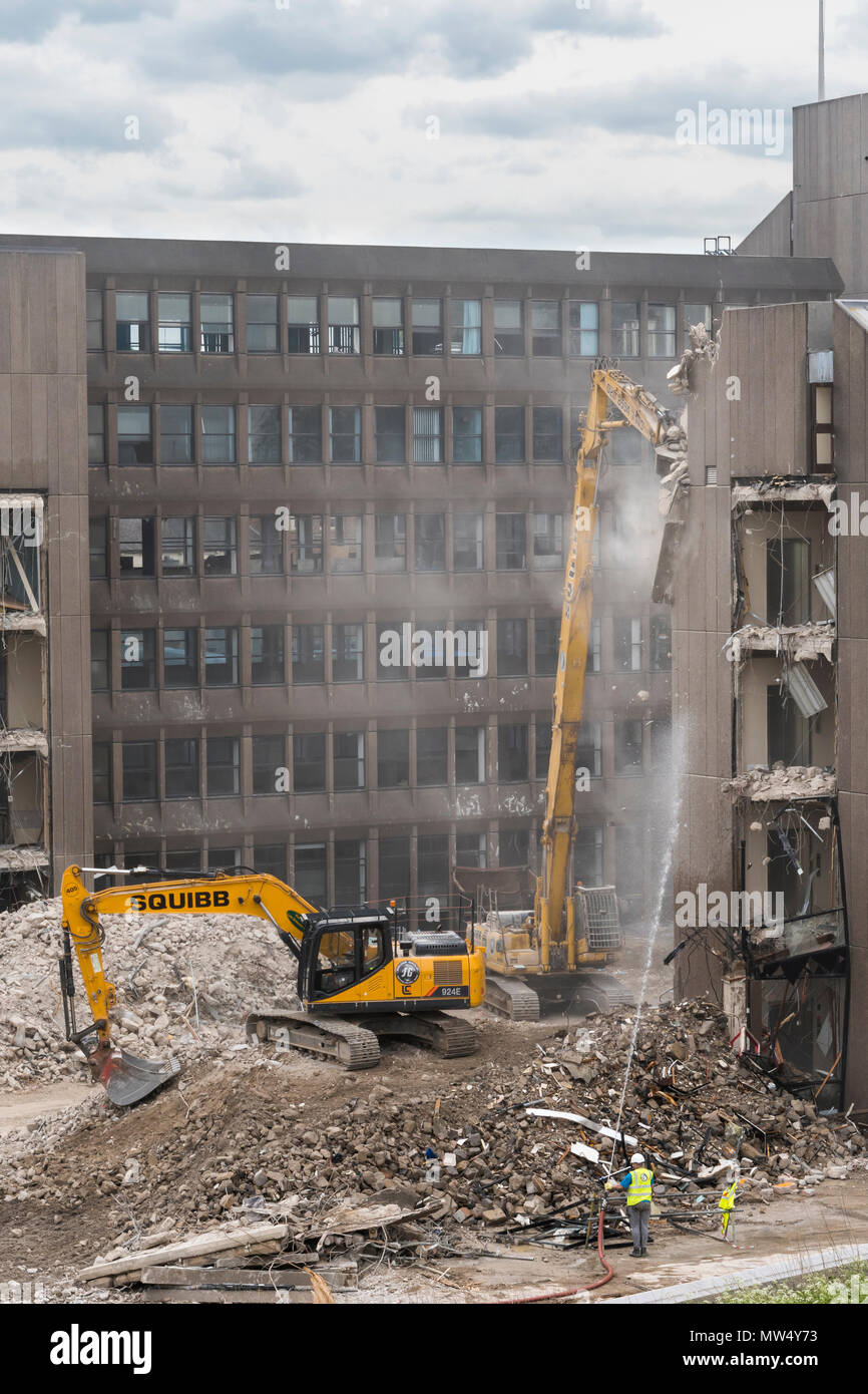 High view of demolition site with rubble, heavy machinery (excavators ...