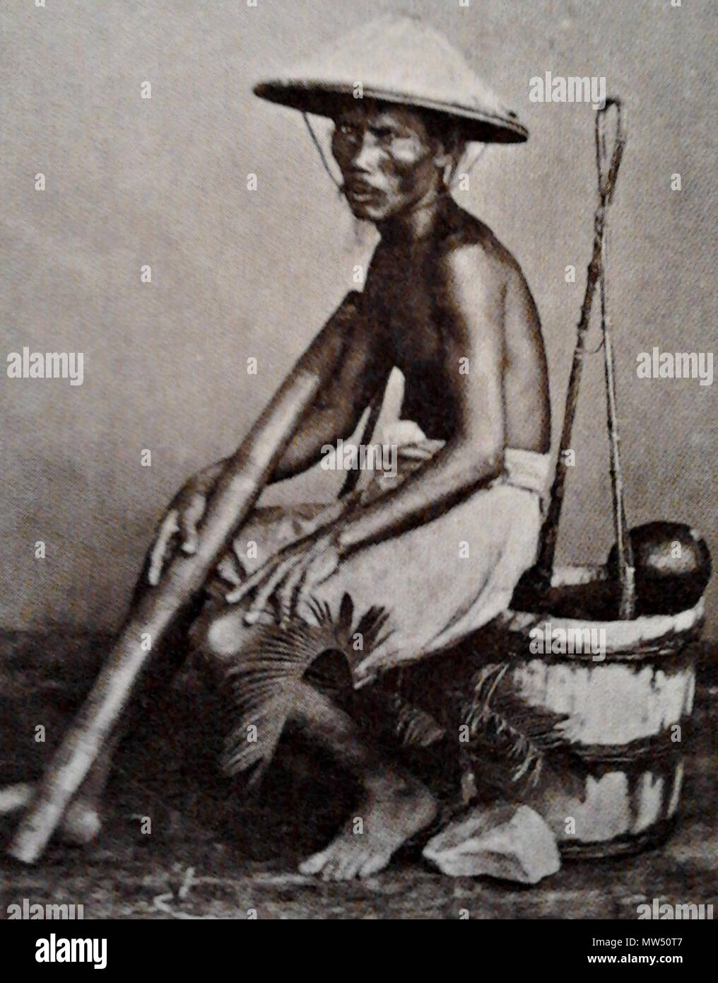 . Français : Marchand avec sa pipe à opium. Photo d'Emile Gsell dans ...