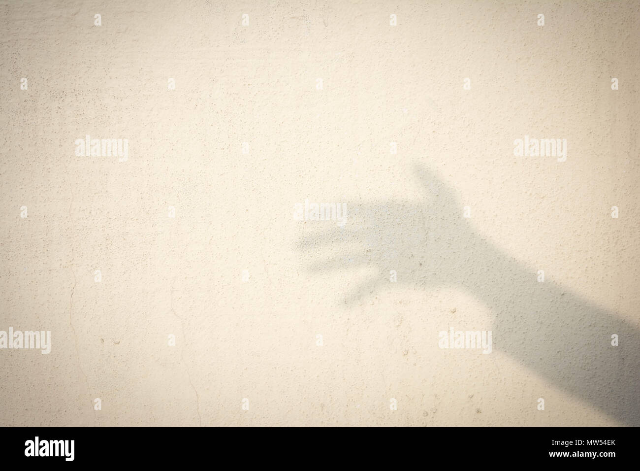 Hand shadow on wall hi-res stock photography and images - Alamy