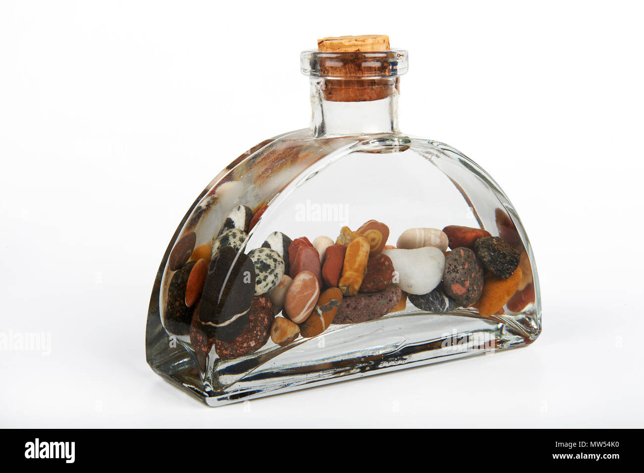 a bottle with some pebbles inside Stock Photo - Alamy