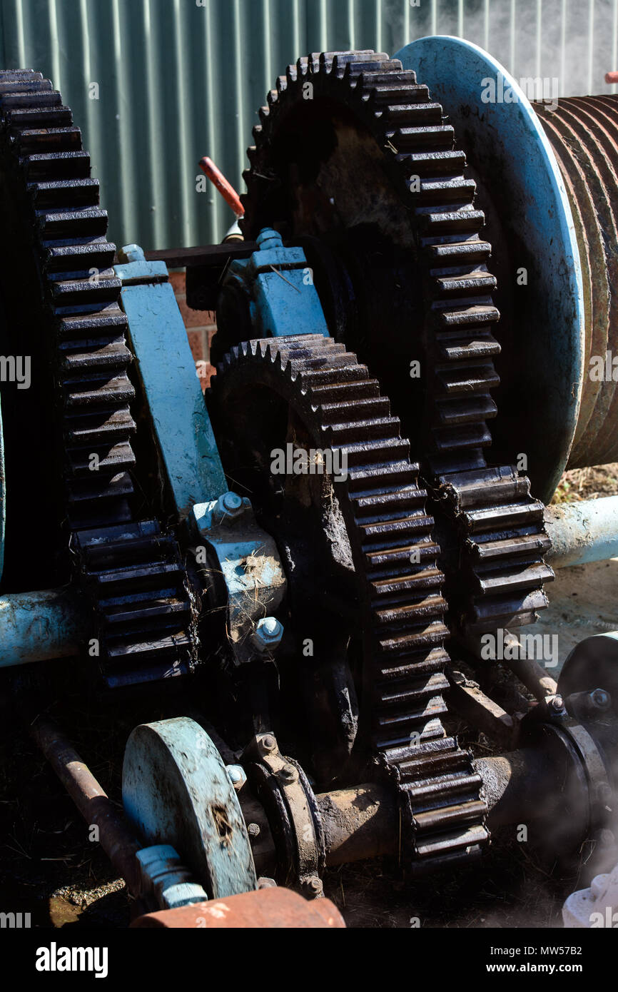 Gear wheels turning cogs in action Stock Photo - Alamy