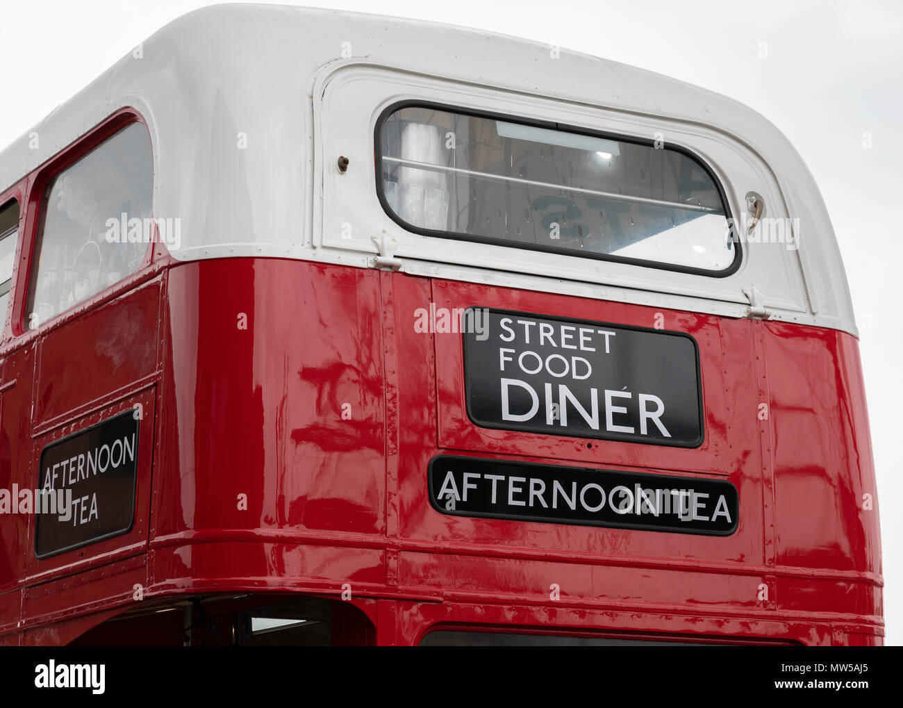 Rear closeup of a double-decker London bus converted to to a street ...