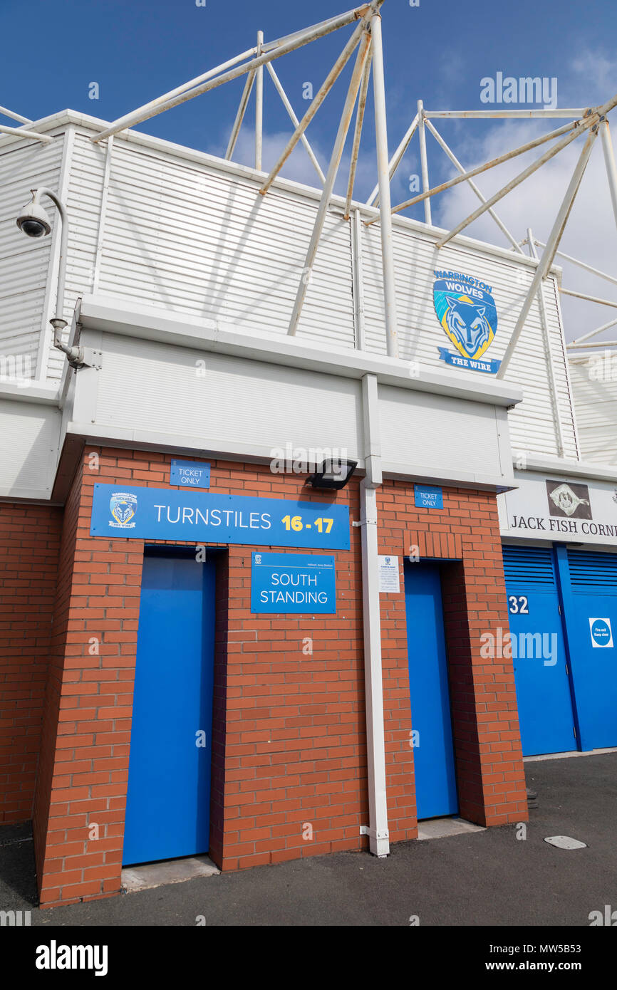 Turnstiles and the logo of rugby league team Warrington Wolves at The ...