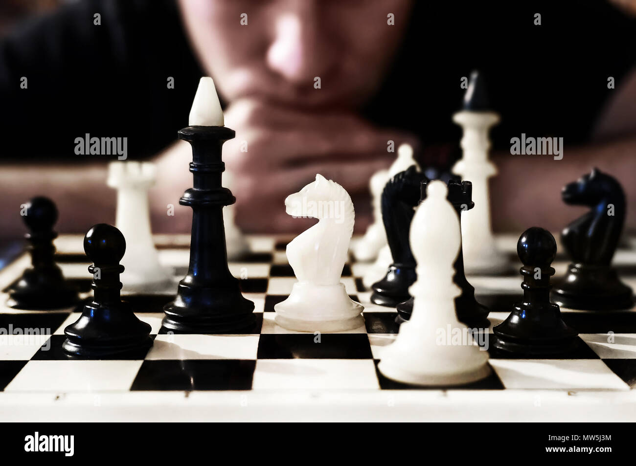 man thinking how to play chess. concept strategy for win. Want to see ...