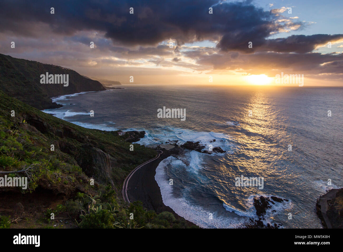 sunset on tenerife island with view on ocean with waves Stock Photo - Alamy