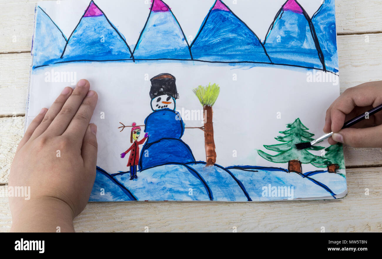 Painting with snowman and a Christmas tree, brush, paint. Process ...
