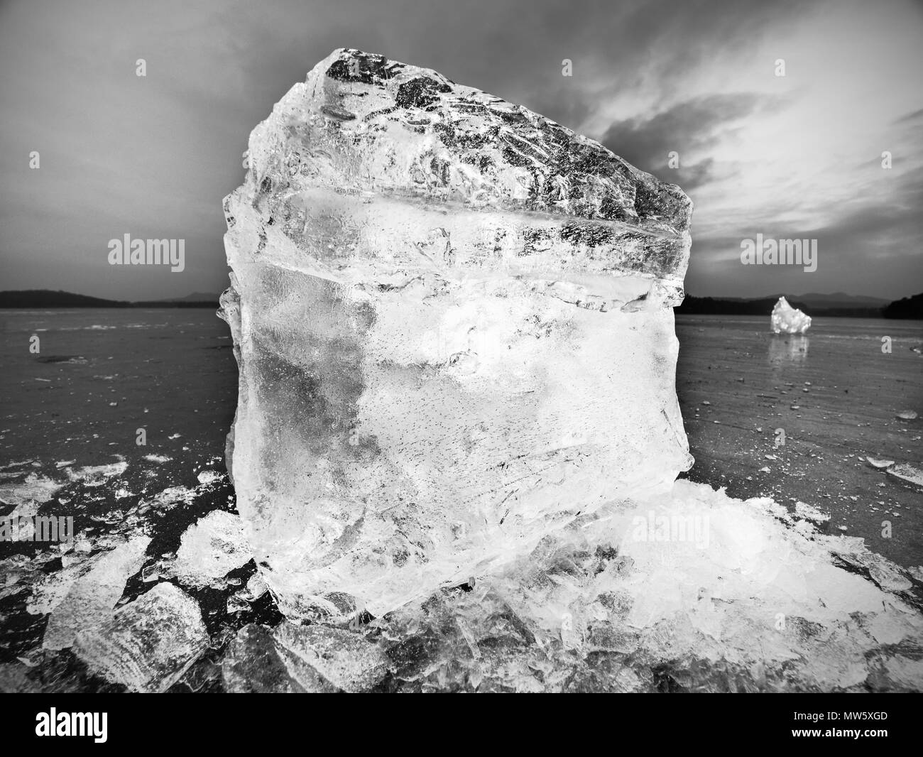 Ice with reflection on the lake. Crushed ice floe on reflective natural ...