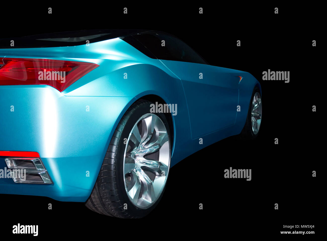 Blue sports car isolated on a black background. Clipping paths included ...