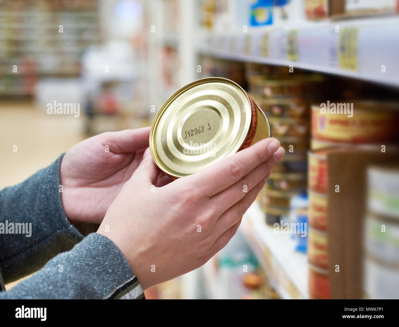 Tin Can In Hands High Resolution Stock Photography and Images - Alamy
