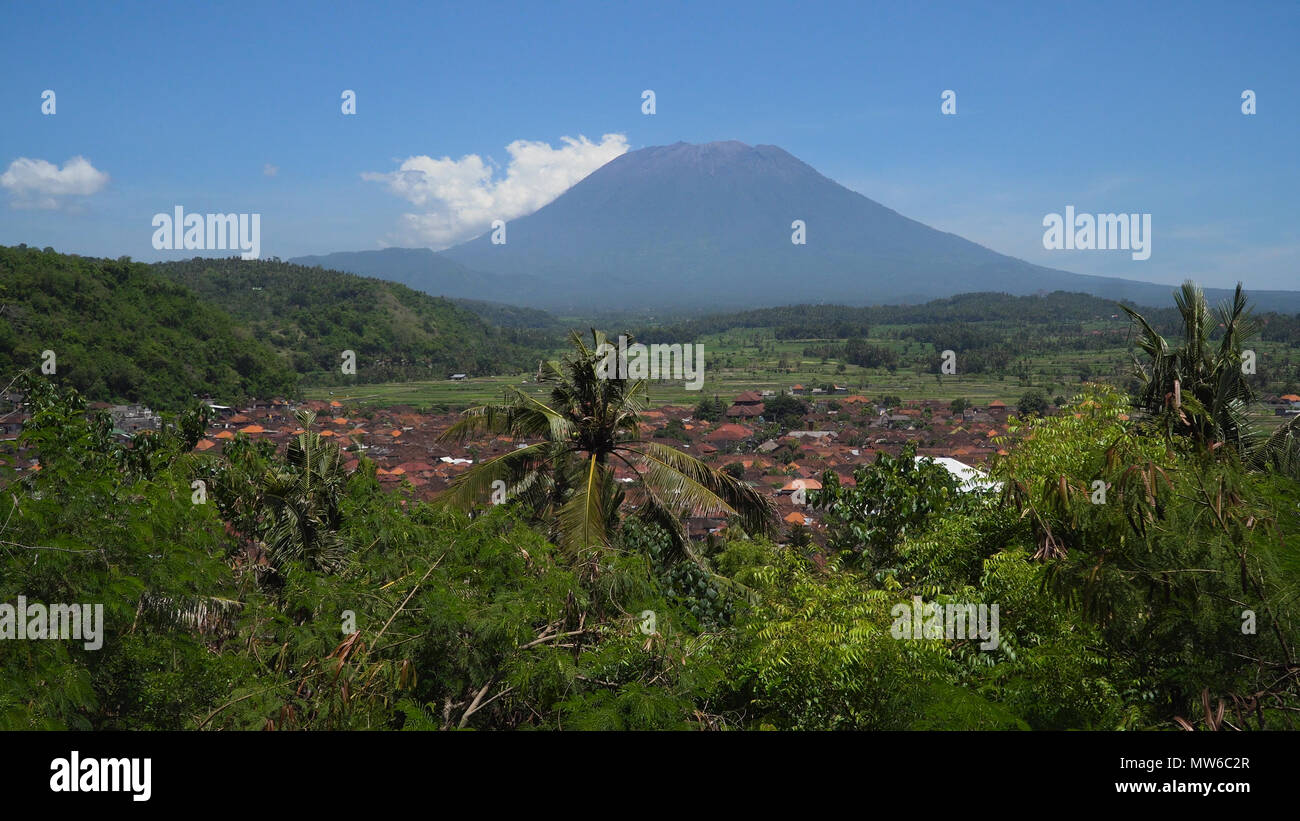 Town near volcano Agung, rice terrace, farmlands, village, fields with ...