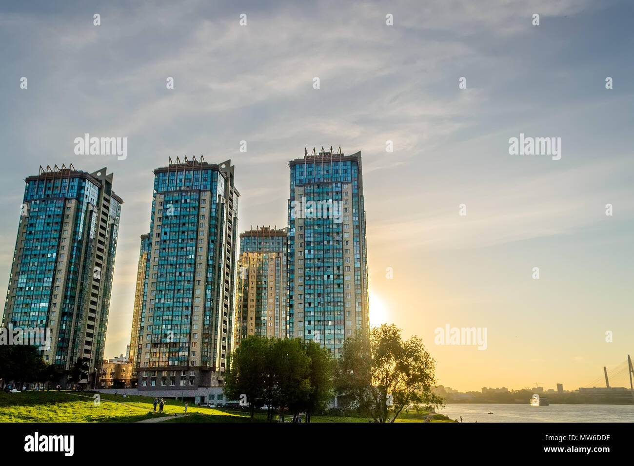 High-rises towers by the river in sunset Stock Photo - Alamy