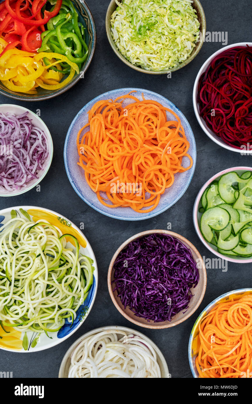Spiralized Vegetables in bowls on a slate background. Pattern Stock ...