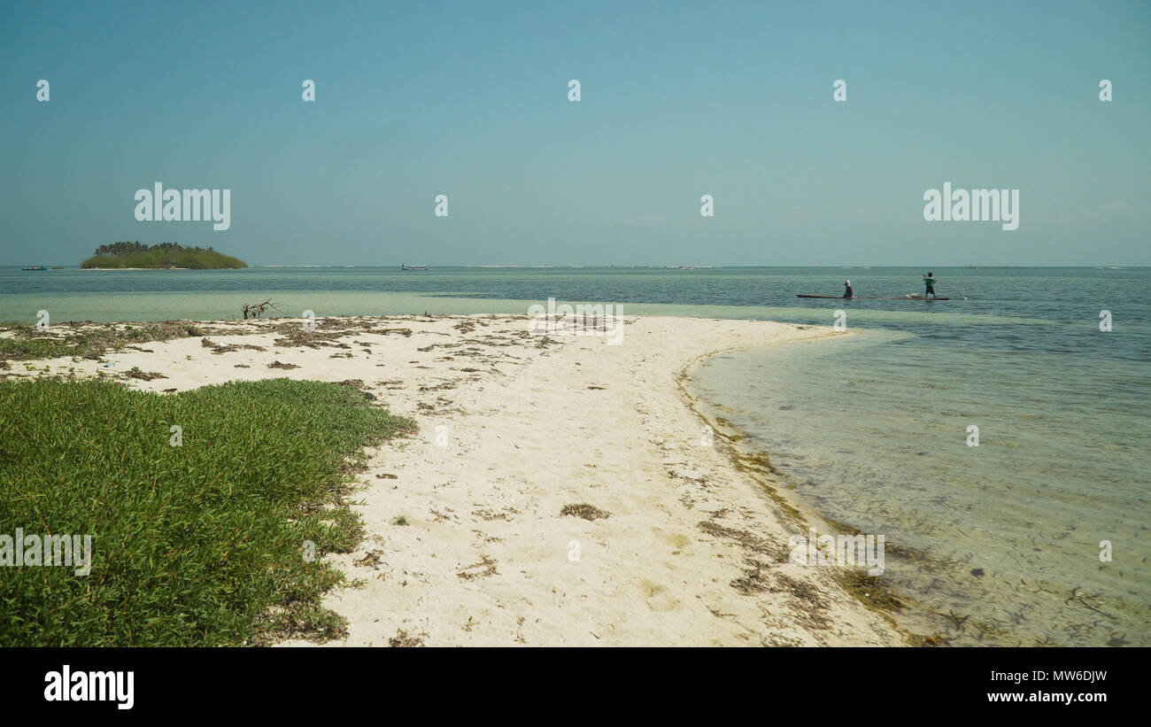 Tropical island with white sandy beach in blue lagoon. Tondol white ...