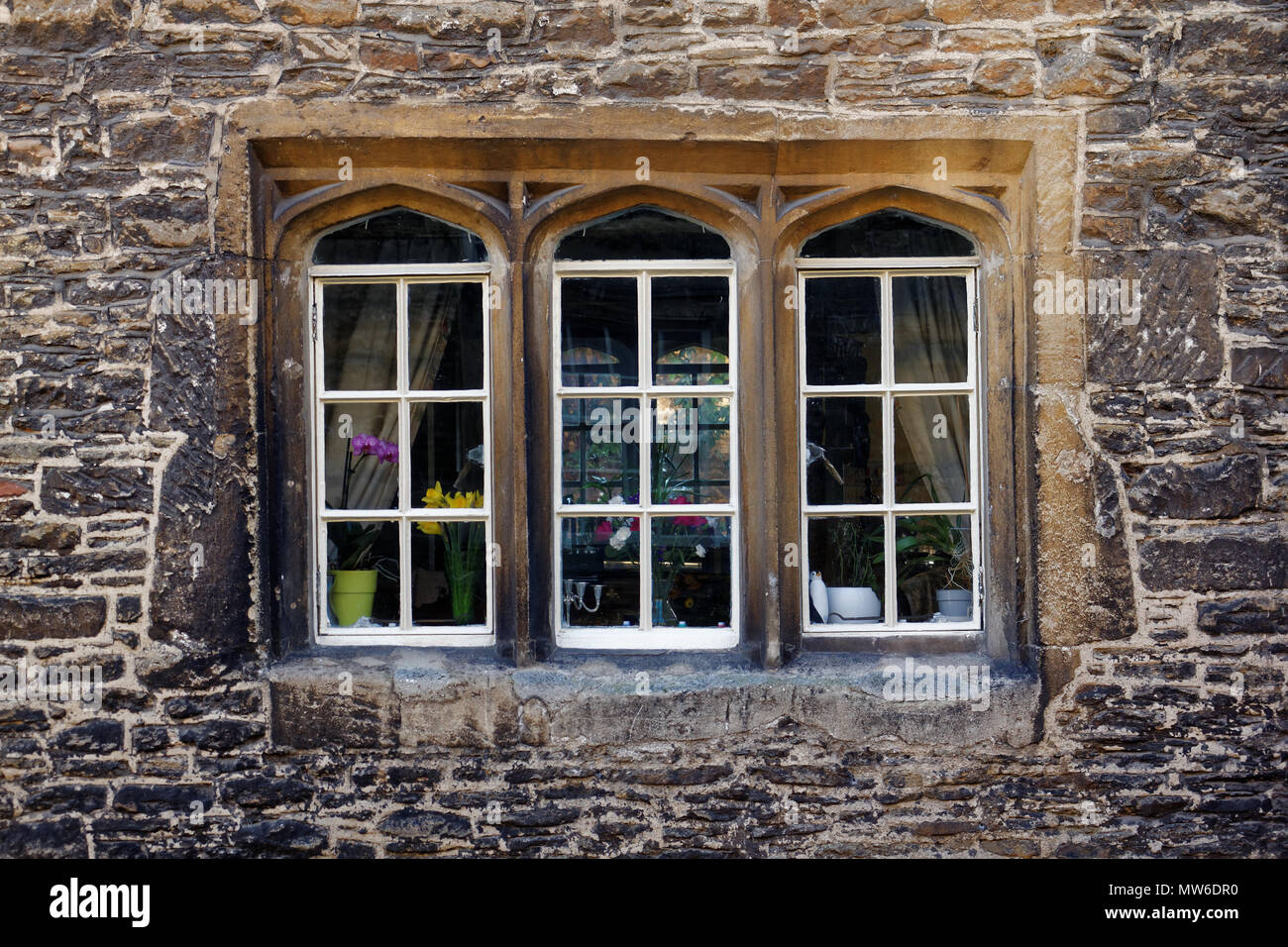 Old stone wall with windows Stock Photo - Alamy