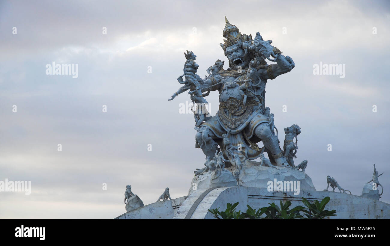 Statue of God fighting with monkeys in Pura Luhur Uluwatu, Bali. Monkey ...