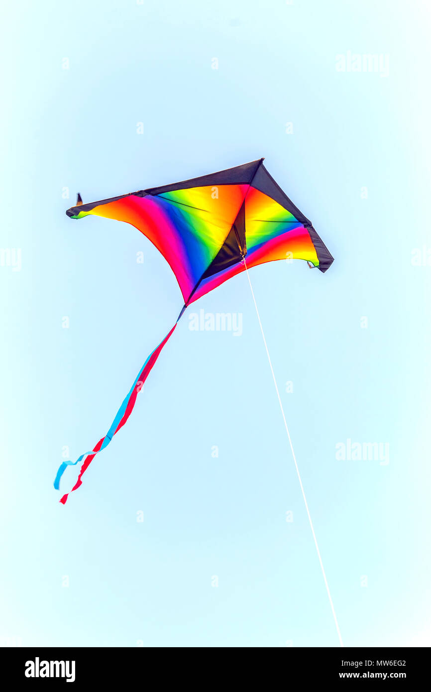 Colorful kite flying on sky background. Retro style, toned photo Stock ...