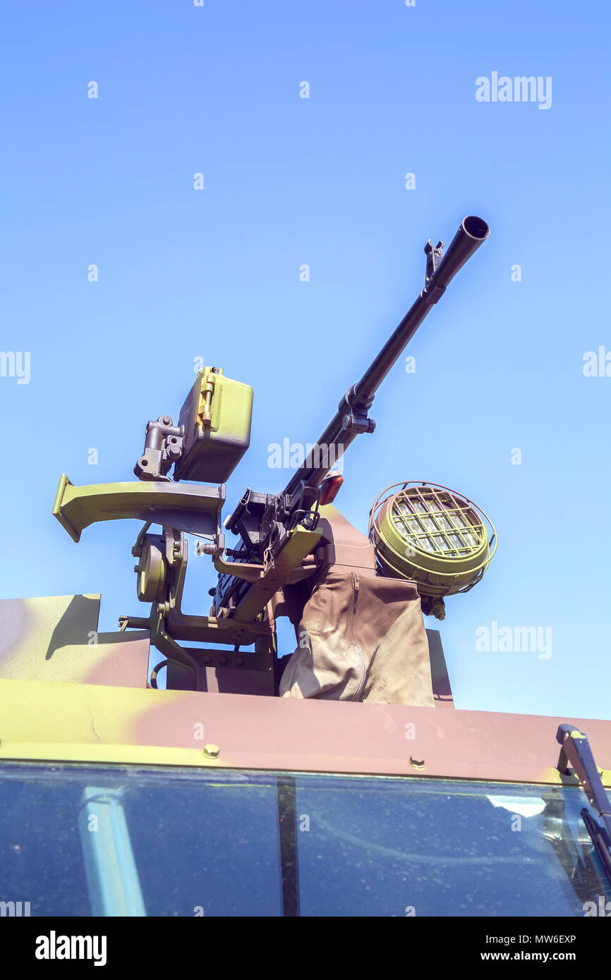 Machine gun integrated on military vehicle. Combat vehicle with HMG ...