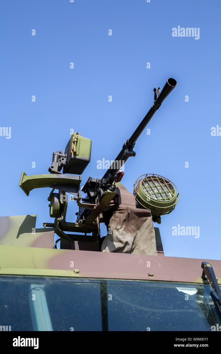 Machine gun integrated on military vehicle. Combat vehicle with HMG ...