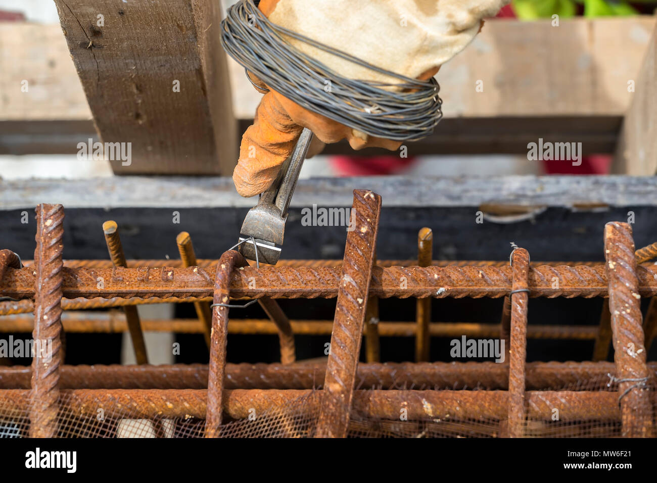 Pincers and steel wire fixing rebar at building site Stock Photo - Alamy