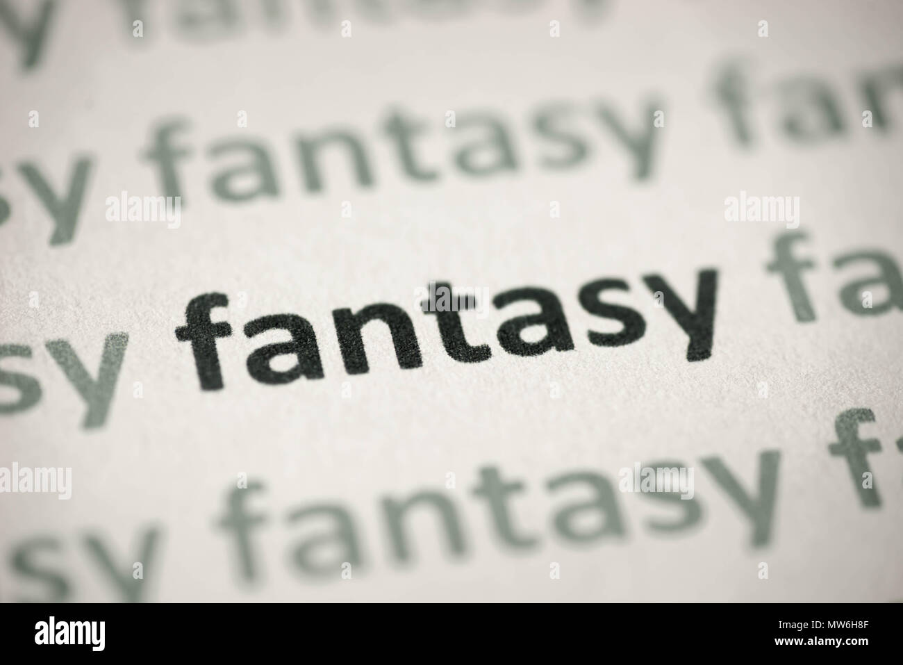 word fantasy printed on white paper macro Stock Photo - Alamy