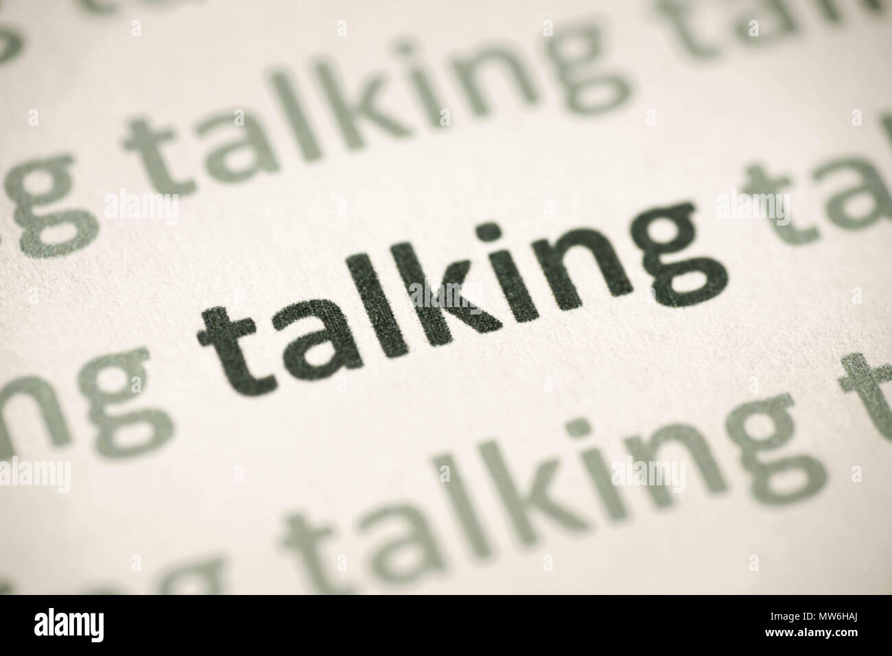 word talking printed on white paper macro Stock Photo - Alamy