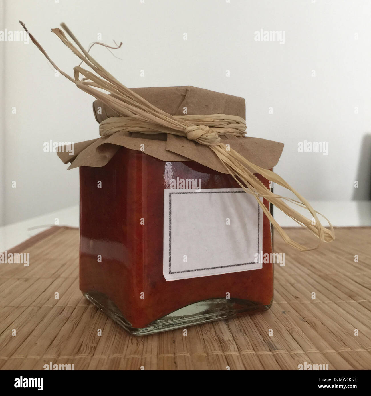 Traditional serbian food ajvar in the glass jar. Ajvar is a pepper ...