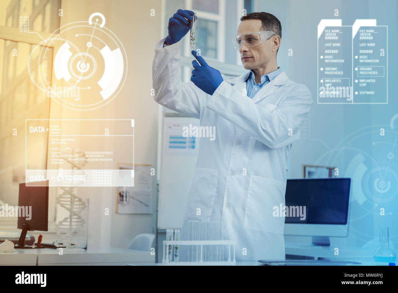 Calm scientist looking at the sample in a test tube and thinking Stock ...