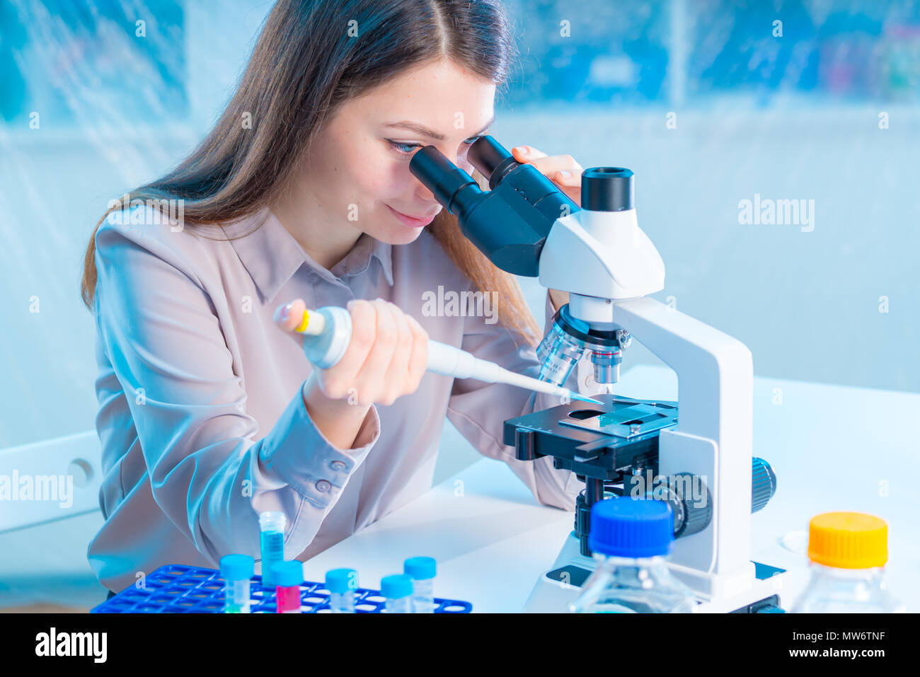 Scientist using microscope in lab hi-res stock photography and images ...