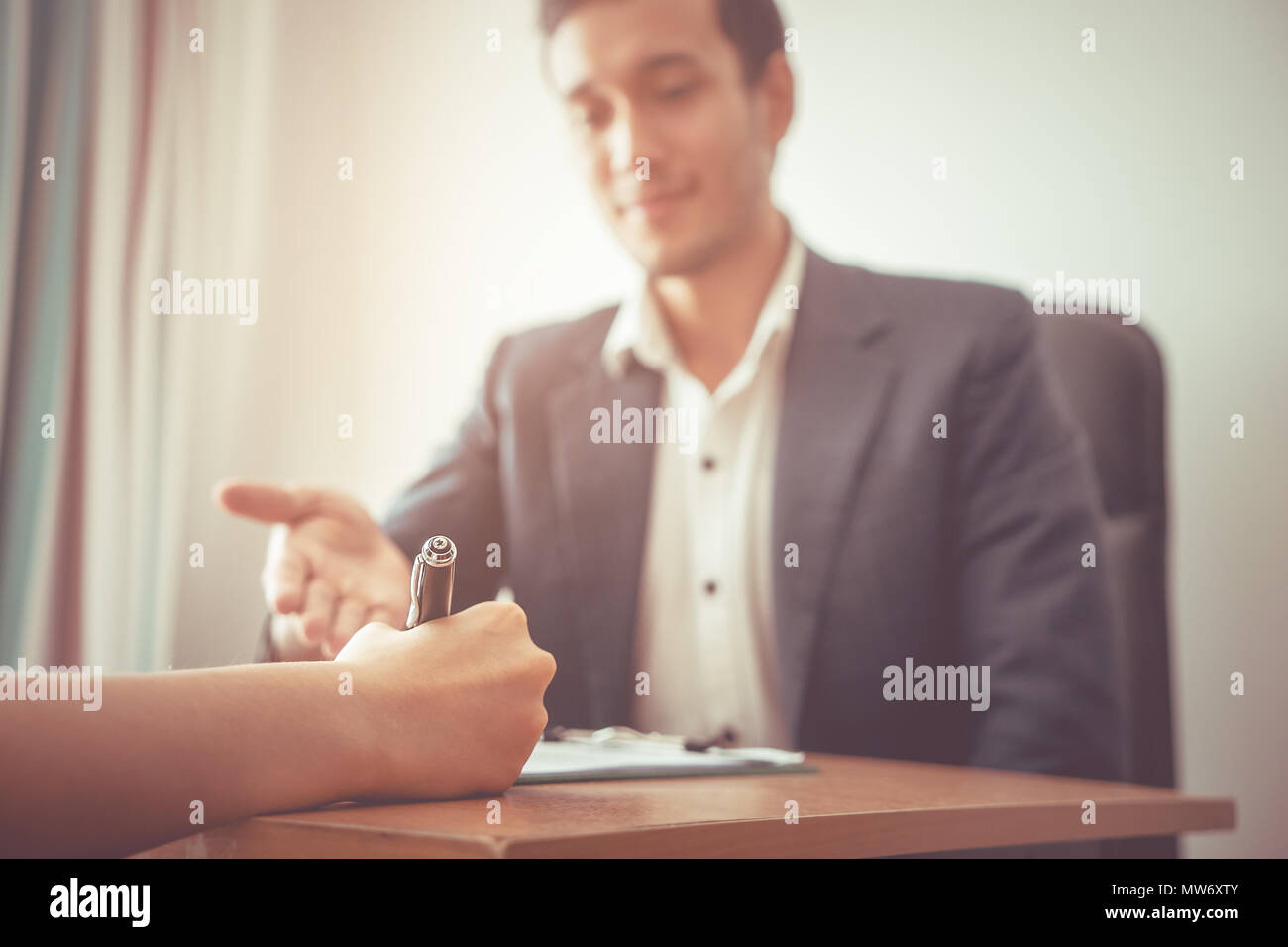 Business man inviting partner to sign a business contract Stock Photo ...