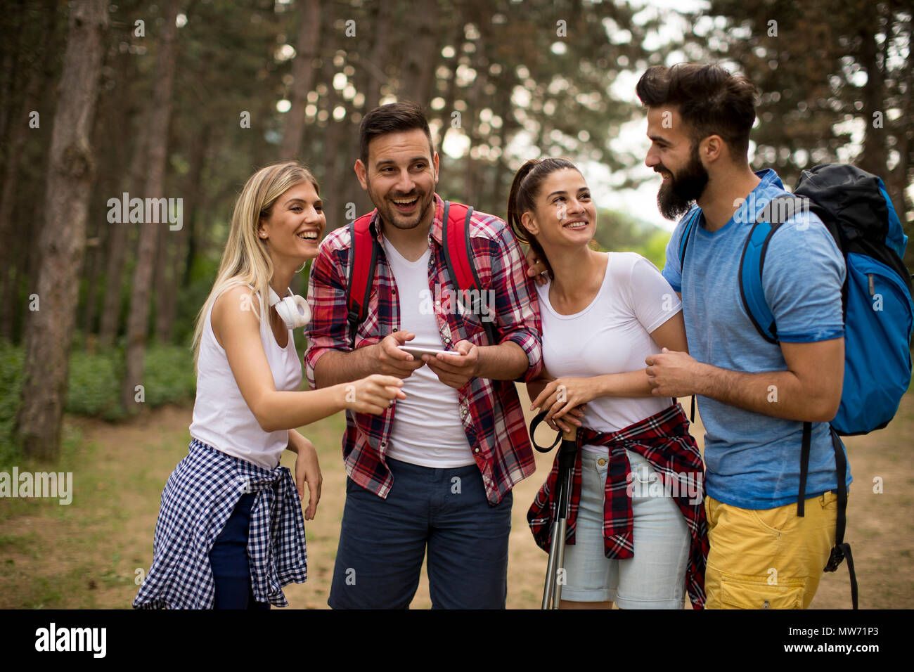 Group of young people hiking in mountain at spring day Stock Photo - Alamy