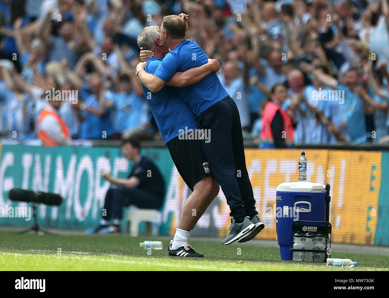 Coventry City manager Mark Robins (right) celebrates with acting ...