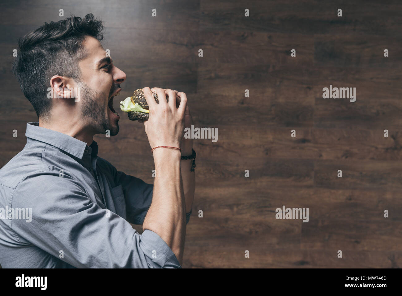 Biting into hamburger hi-res stock photography and images - Alamy