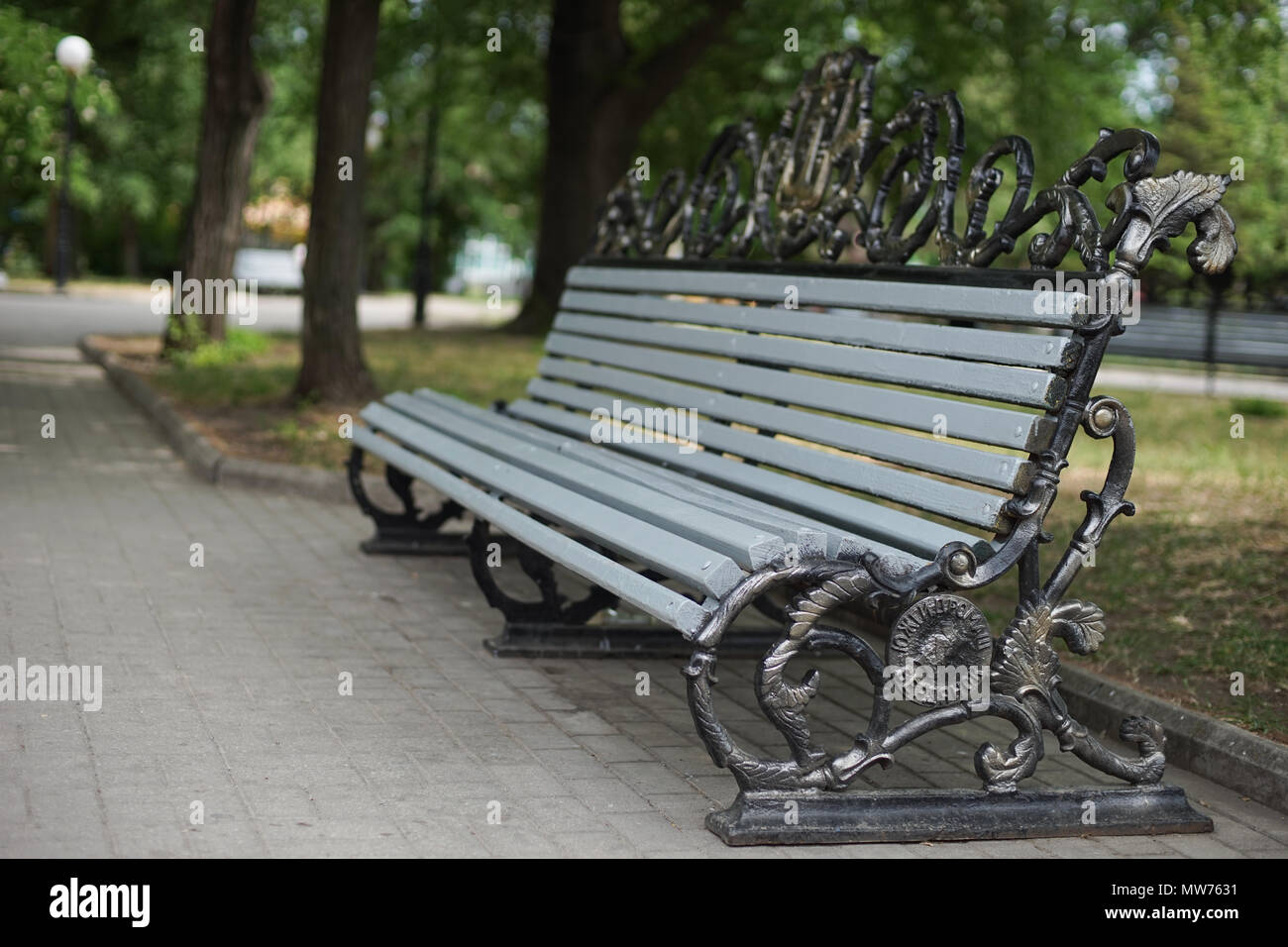 City bench in the park Stock Photo - Alamy