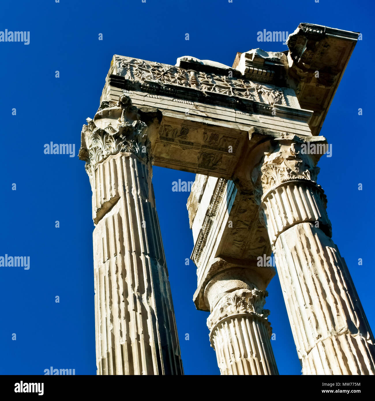 Low angle view of three columns from Apollo Sosiano's Temple, Sunny ...
