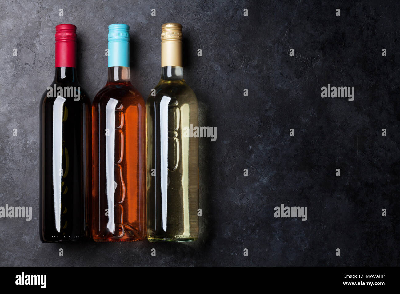 Red, rose and white wine bottles. Top view with space for your text ...