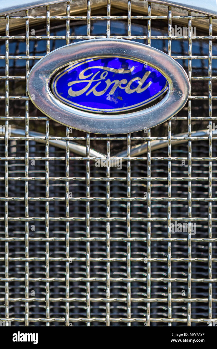 A closeup of a vintage Ford name badge and the geometric pattern formed ...