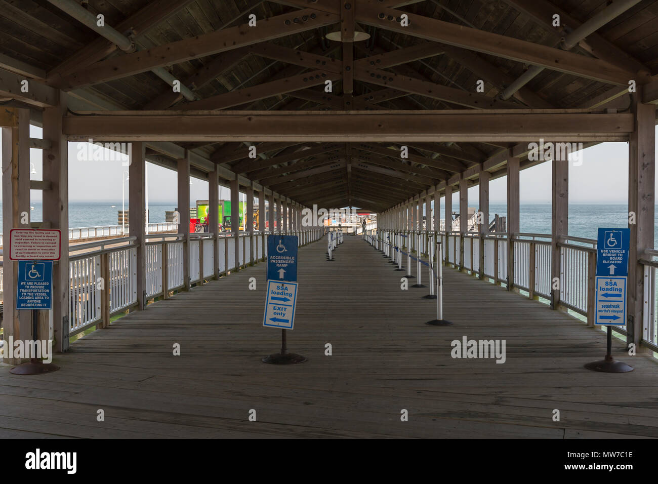 A covered pier leads travelers to/from the ferries arriving and ...