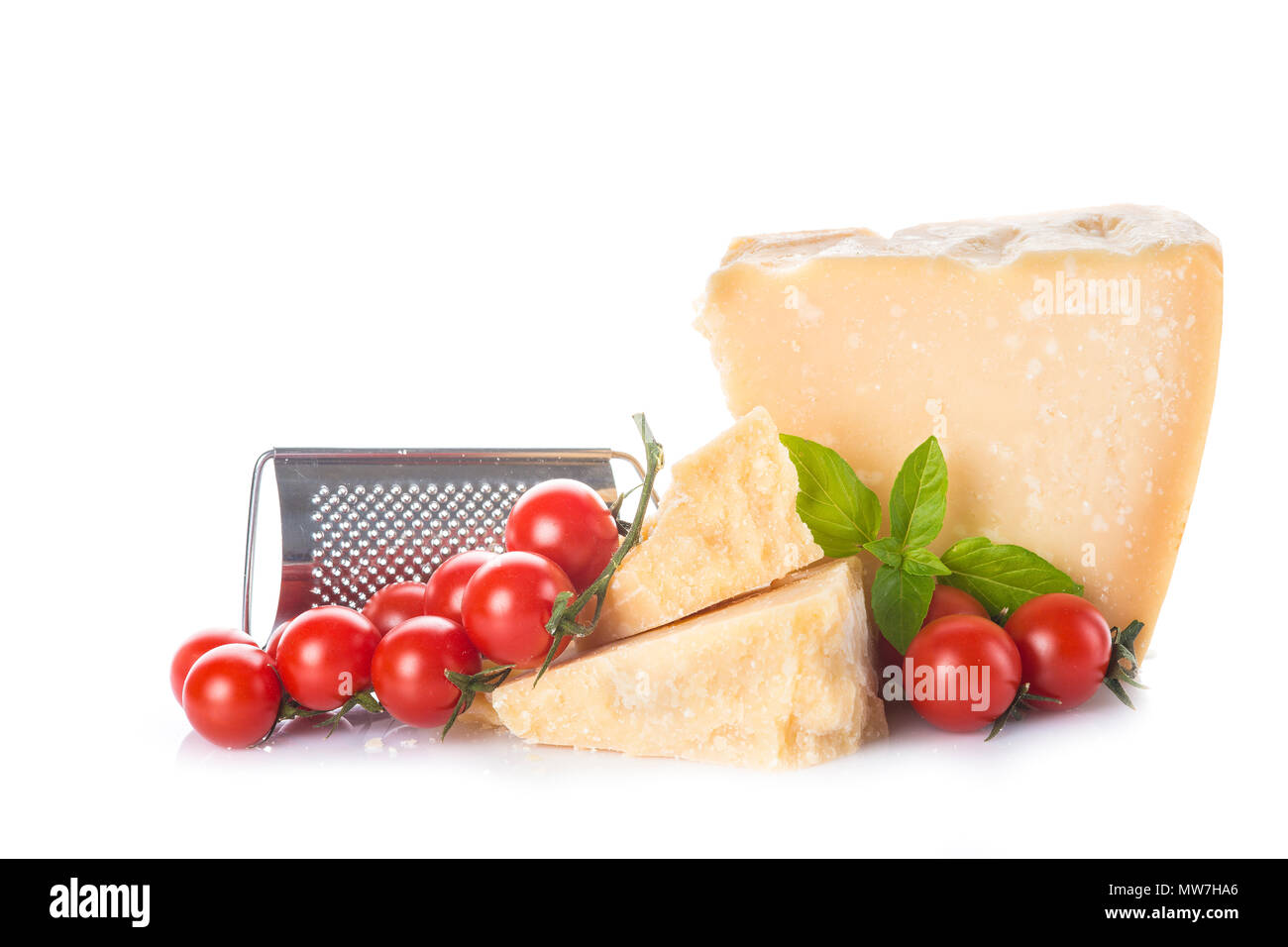 Parmesan cheese or parmigiano reggiano with cherry tomatoes and basil ...