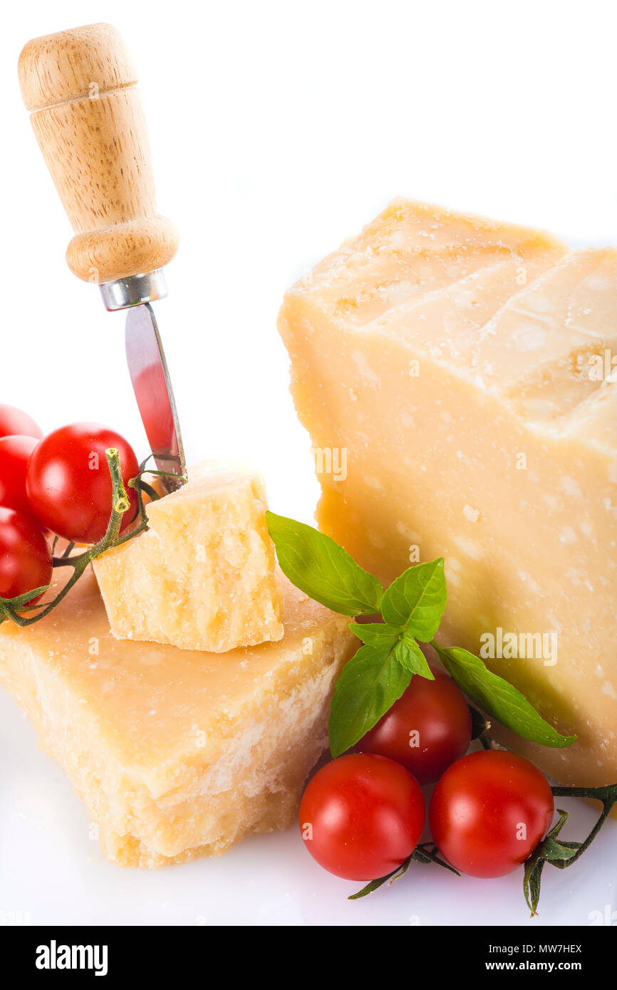 Parmesan cheese or parmigiano reggiano with cherry tomatoes and basil ...