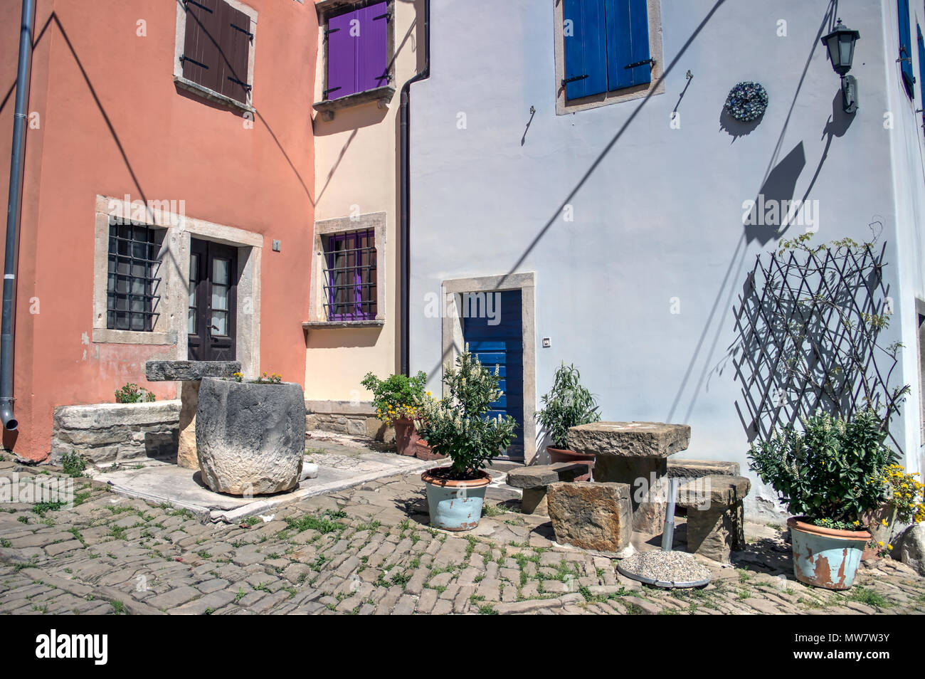 Central Istria, Croatia - Stone benches and tables in front of an ...