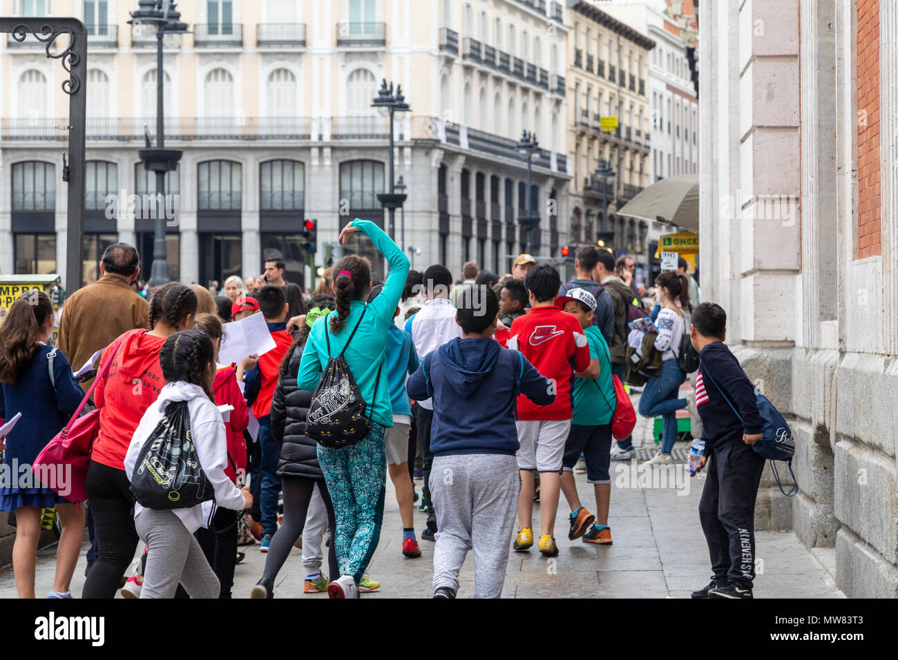 Young kids walking in the street in Madrid, Spain Stock Photo - Alamy