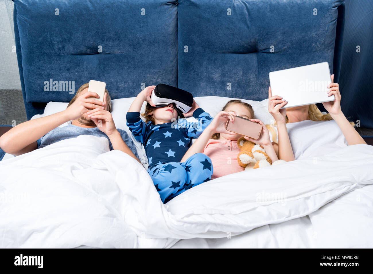 Gadgets family bed hi-res stock photography and images - Alamy