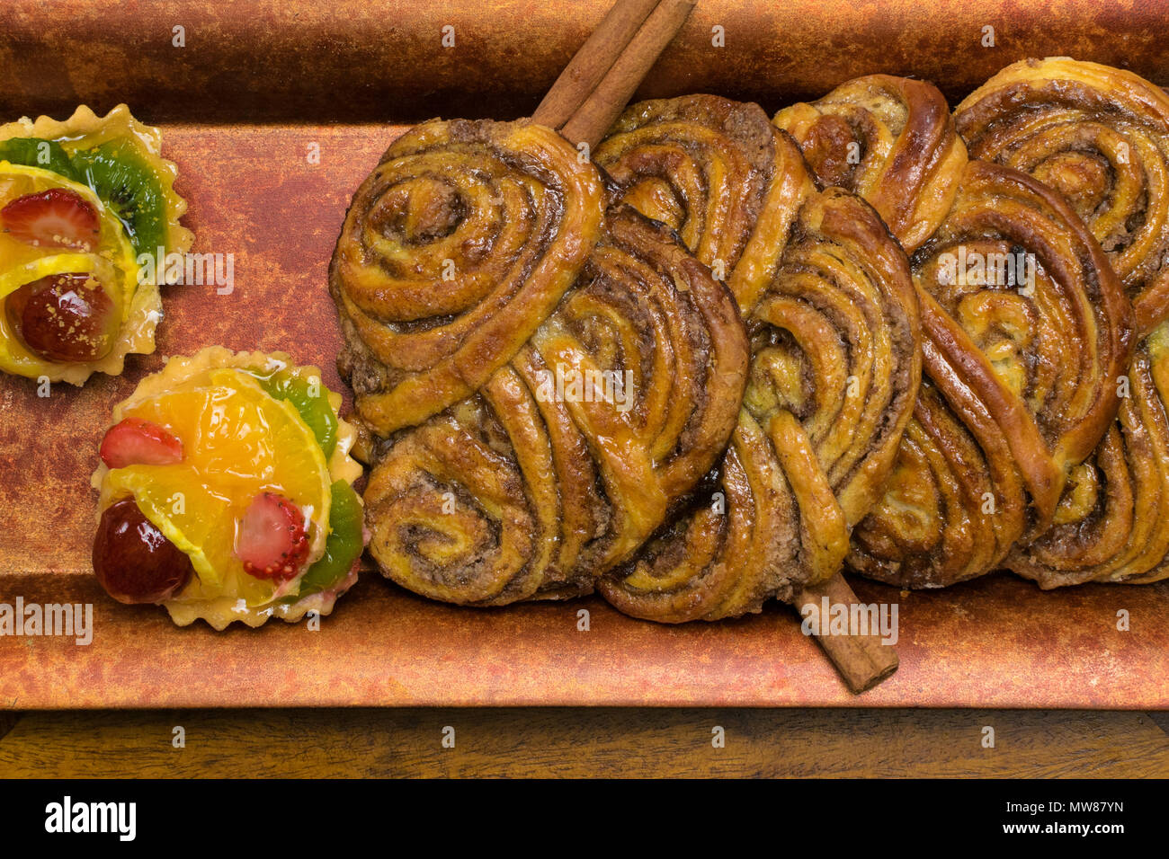 sweet cinamon buns and fruit cakes. Unhealthy food and diet time ...